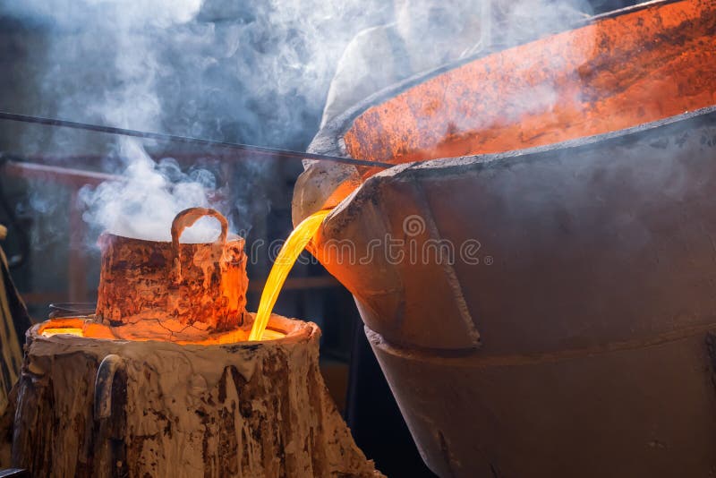 The Process of Pouring Molten Metal into a Mold Stock Image - Image of ...