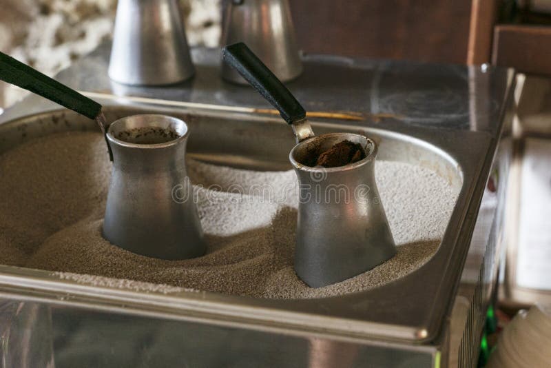 Process of Preparation Traditional Turkish Coffee in Hot Sand. Stock ...