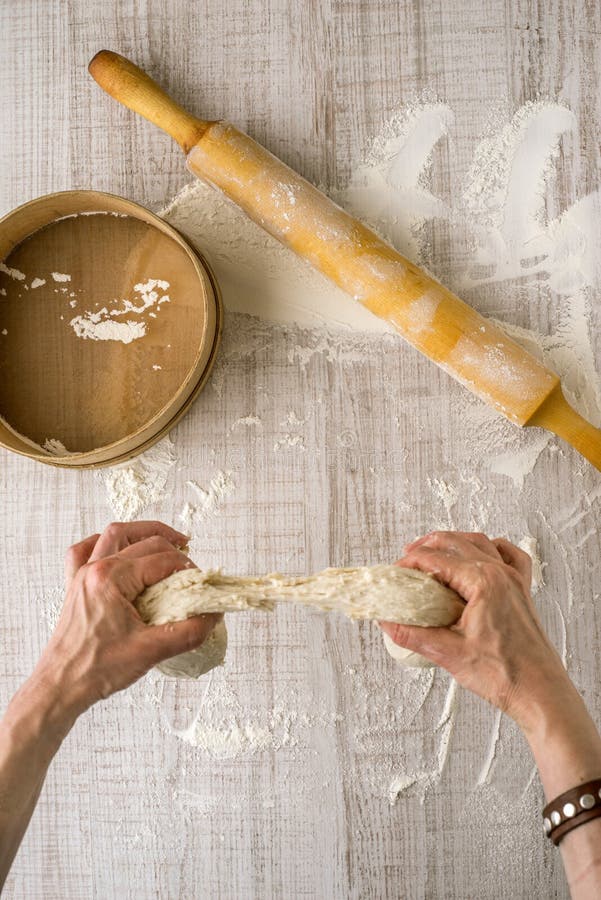 Process of Preparing the Dough, Hands, a Rolling Pin, Sieve Flour Stock ...