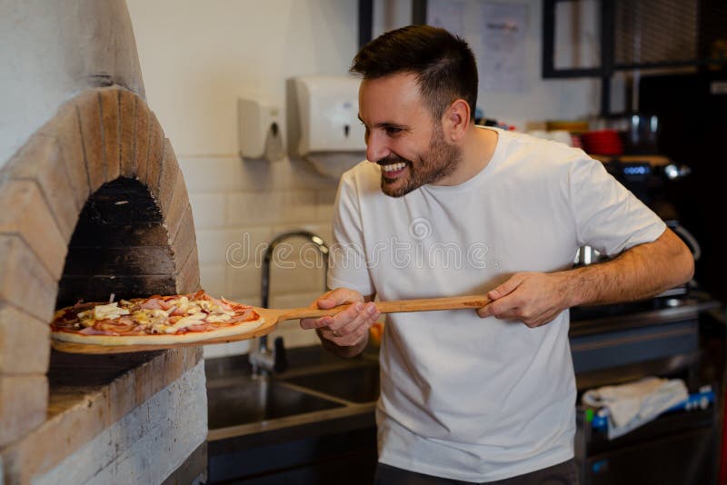 A Process of Preparing Pizza by a Chef.Italian Traditional Pizza is ...