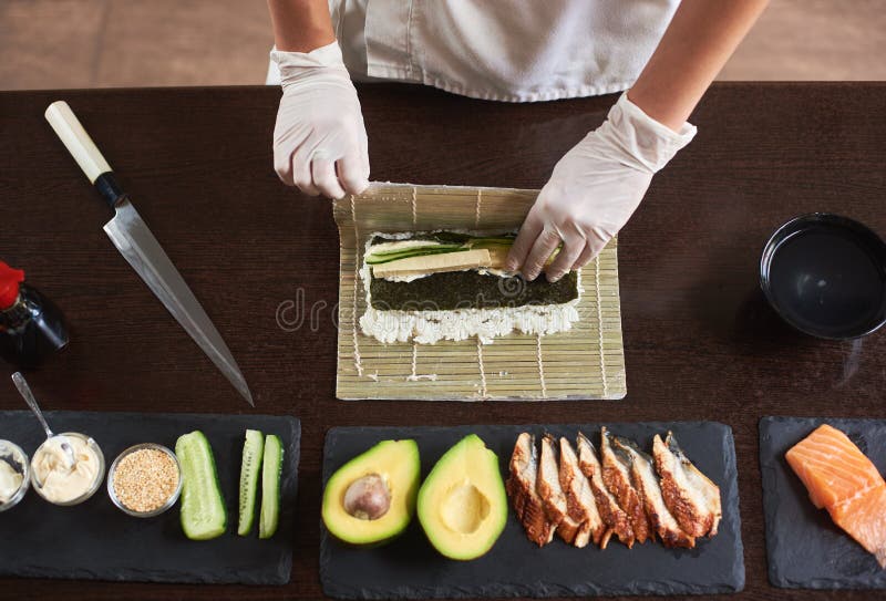 Process of Preparing Rolling Sushi Stock Photo - Image of hands ...