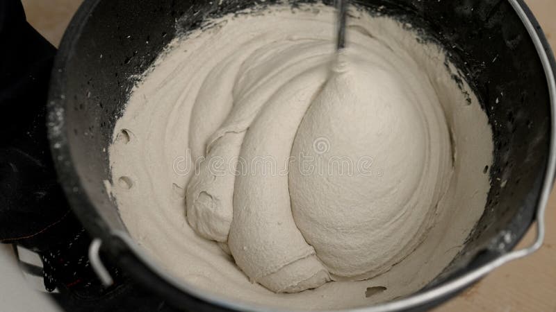 The Process of Preparing Tile Adhesive or Cement Mortar. Mechanical ...