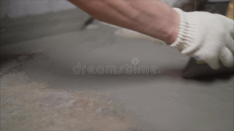 Concrete Repair: Skilled Hands Mixing Cement for Building Restoration ...