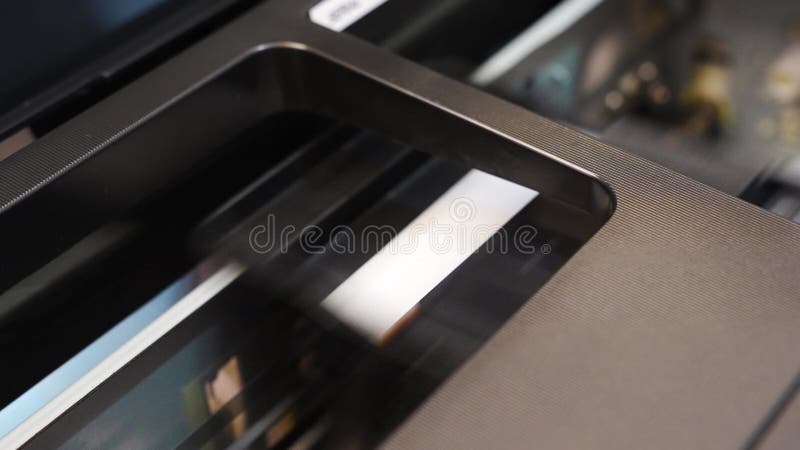 The Process of Printing on a Photo Printer. Printer for Home or Office ...