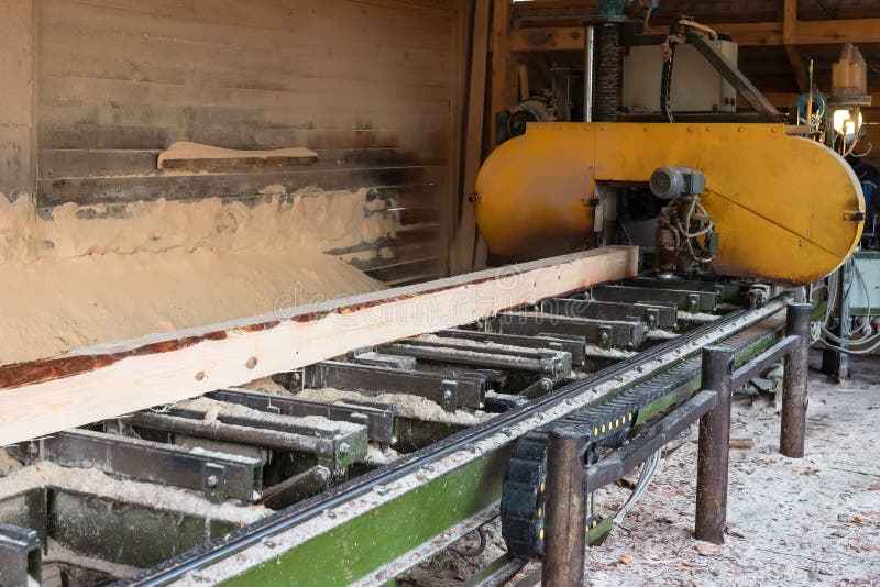 The Process of Processing Wood at the Sawmill. Timber Industry Stock ...
