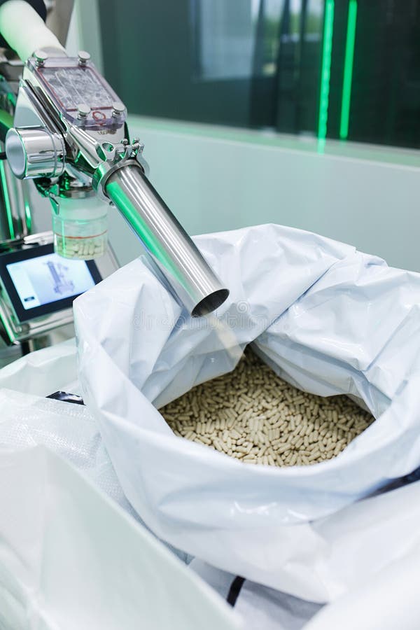 The Process of Production of Drugs and Tablets Close-up. Device for ...