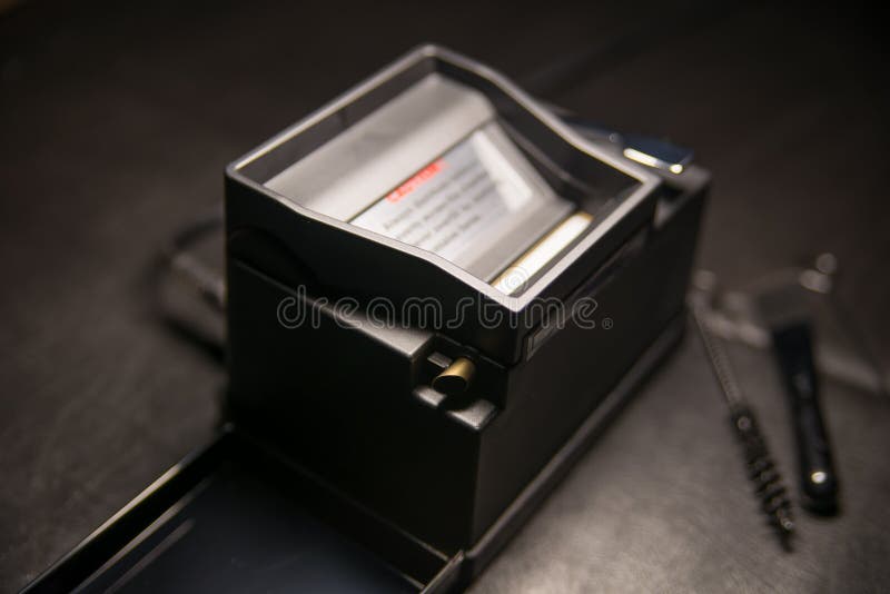 The Process of Putting Tobacco into Cigarette Cases with a Semi ...