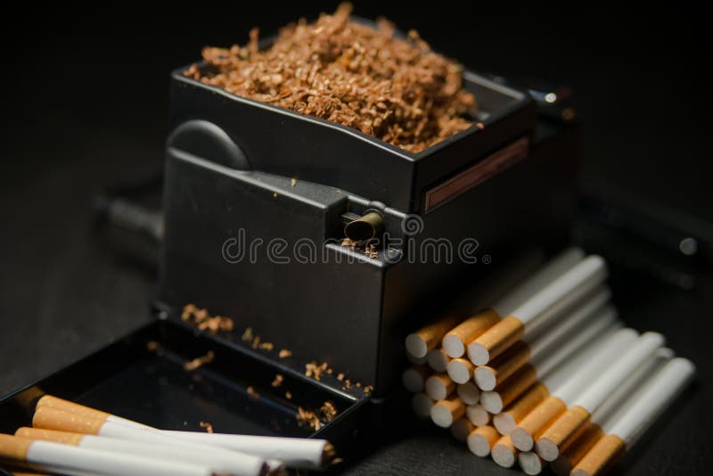 The Process of Putting Tobacco into Cigarette Cases with a Semi ...