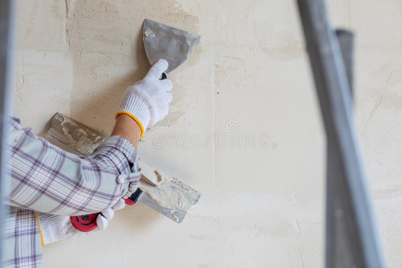 The Process of Puttying before the Construction Ladder Stock Photo ...