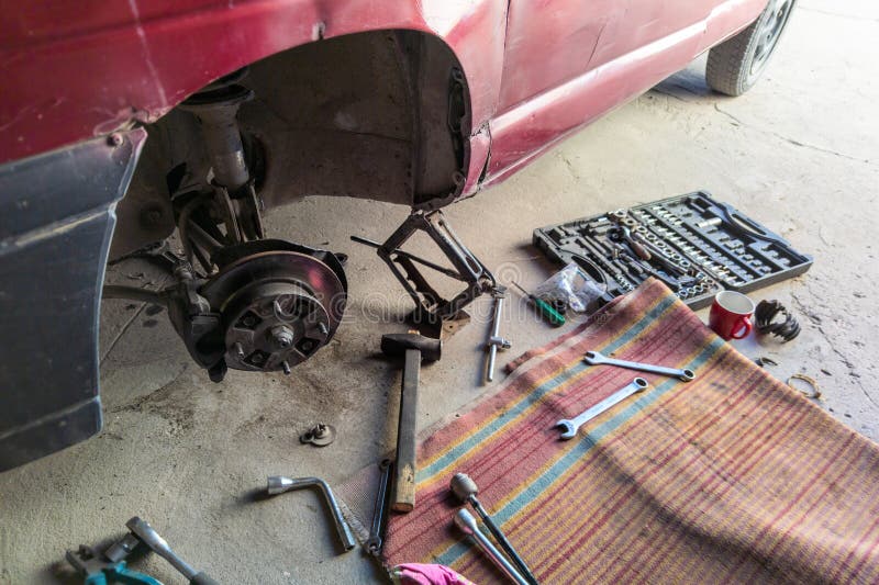 Process of Repair an Old Red Car with Old Poor Tools on Concrete ...