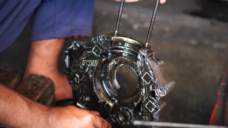 The Process of Repairing a Motorcycle Engine Manually Stock Video ...