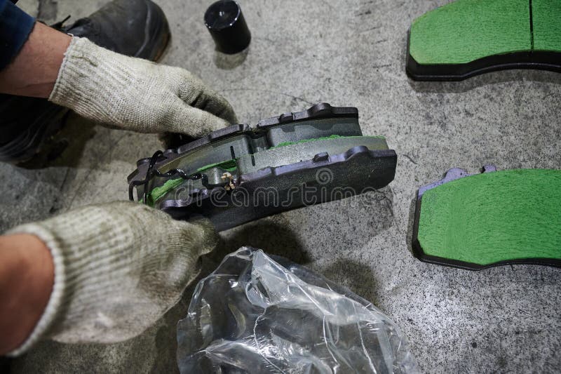 The Process of Replacing Brake Pads on a Regular Bus in a Workshop ...