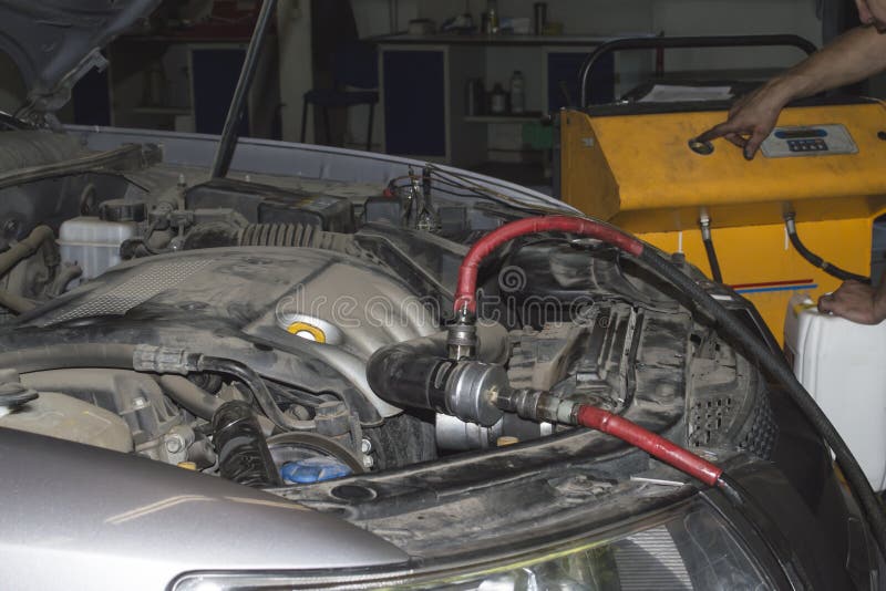 The Process of Replacing the Coolant on the Car with a Special Device ...