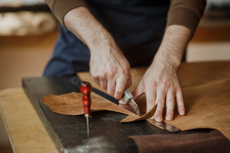 Process of Revealing Piece of Leather in Workshop Stock Photo - Image ...