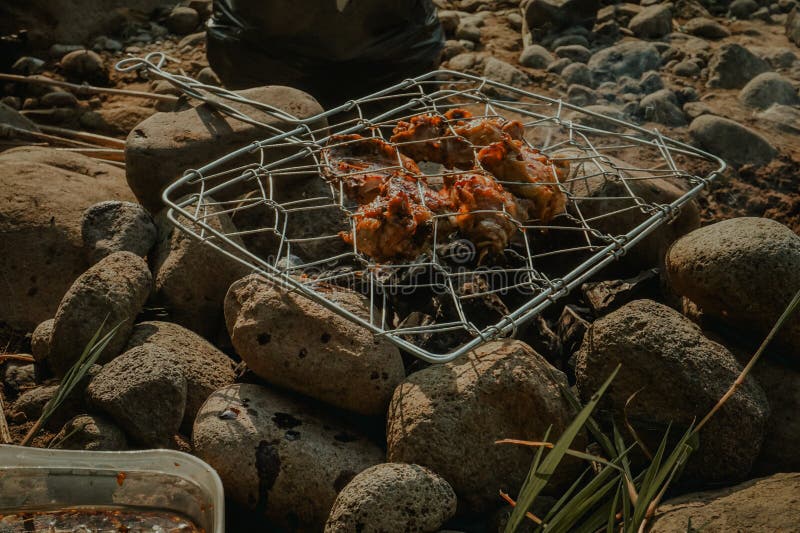The Process of Roasting Chicken with a Stone Stove Stock Image - Image ...