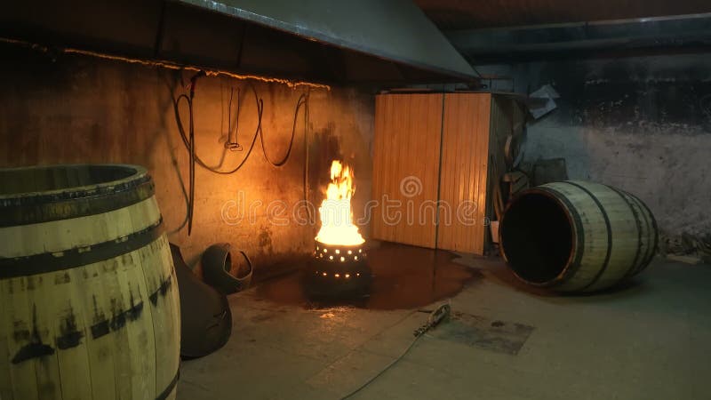 Process of Roasting Oak Barrels for Wine in a Cooperage Stock Footage ...