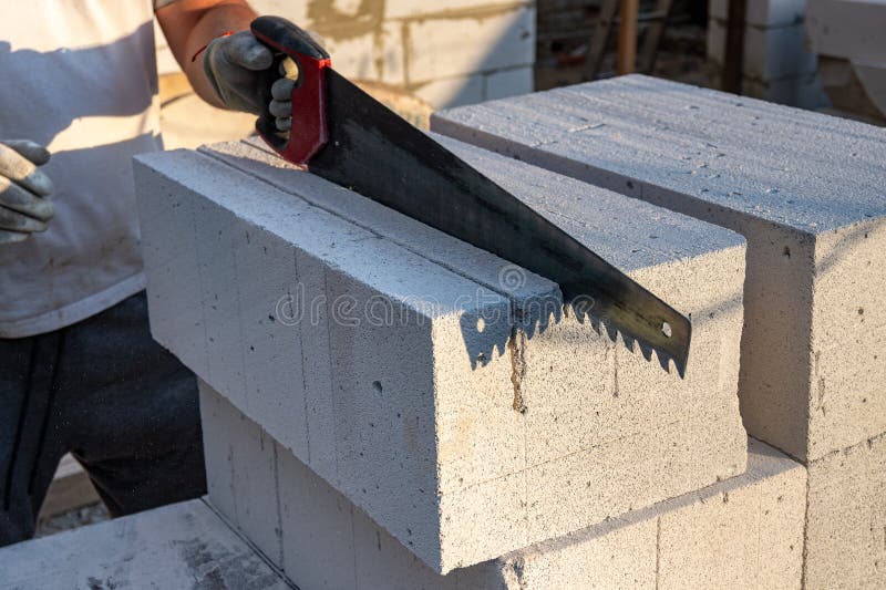The Process of Sawing Aerated Concrete Blocks with a Hand Saw ...