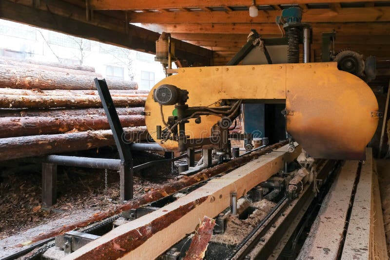 The Process of Sawing Wood on Sawmill Equipment. Timber Industry Stock ...