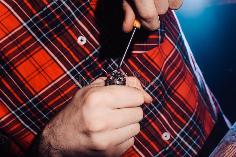 The Process of Servicing the Mechanical Vape Device. Master Replace ...