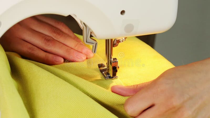 The Process of Sewing Fabric on a Sewing Machine, the Sewing Machine ...