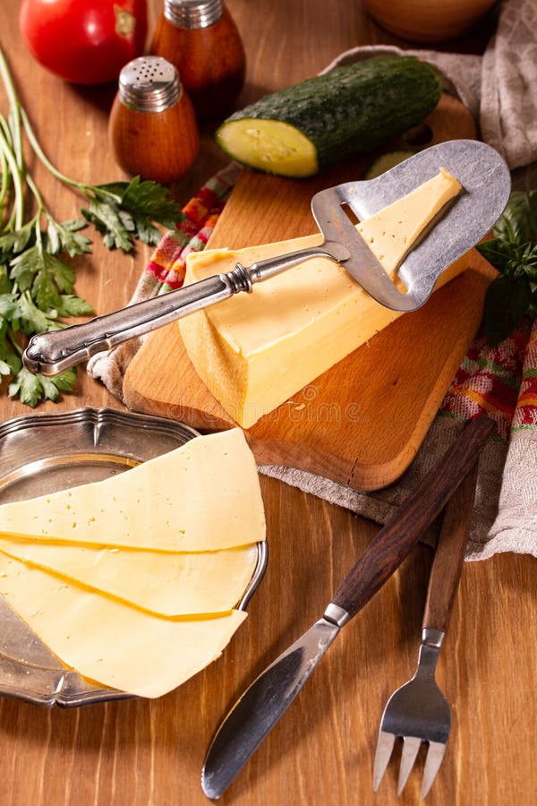 Process of Slicing Fresh Cheese Slicer in the Kitchen Stock Image ...
