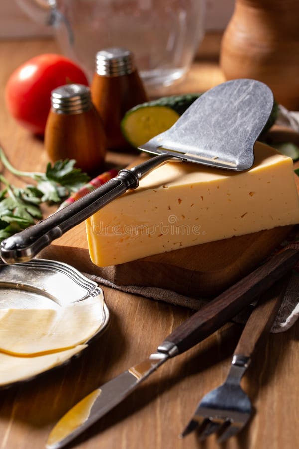 Process of Slicing Fresh Cheese Slicer in the Kitchen Stock Photo ...
