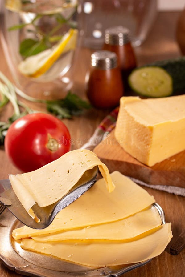 Process of Slicing Fresh Cheese Slicer in the Kitchen Stock Photo ...