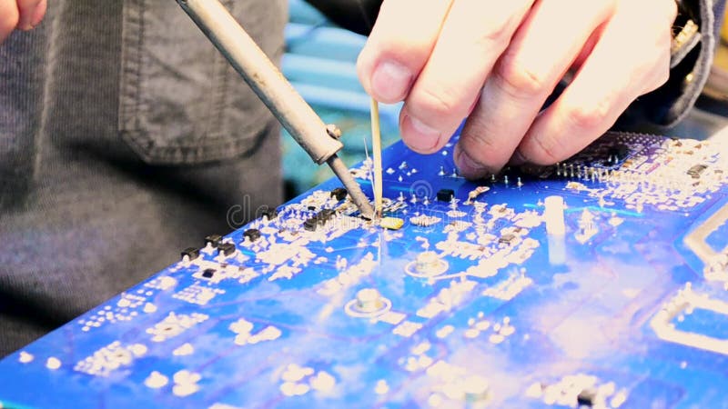 The Process of Soldering the Chip, Engineering Work. Shot. Close Up of ...