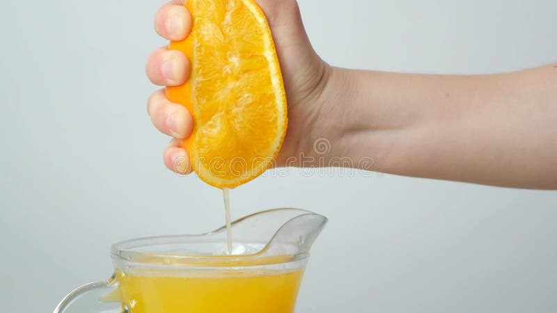 The Process of Squeezing Orange Juice from Half a Fresh Orange, Slow ...