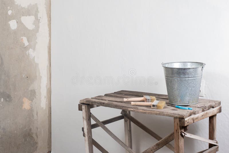 The Process of Sticking White Wallpaper, a Bucket of Glue. with a Place ...