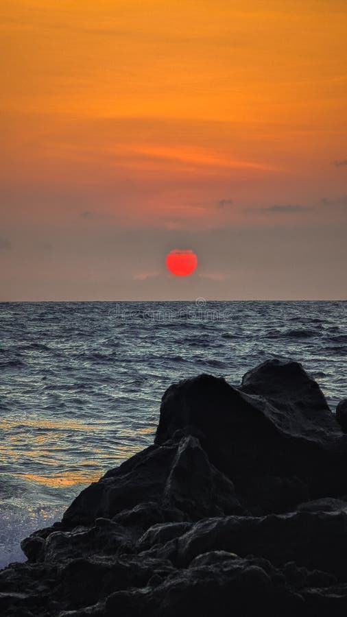 The Process of the Sun Setting in the Middle of the Ocean with Its ...
