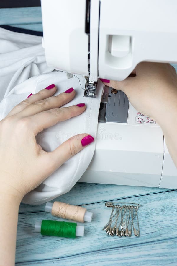 Hands on the Sewing Machine Stock Image - Image of clothes, action ...