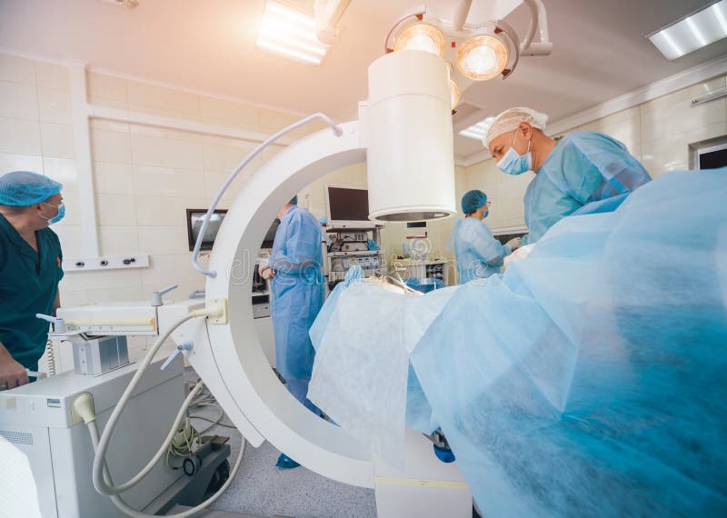 Process Of Trauma Surgery Operation. Group Of Surgeons In Operating ...
