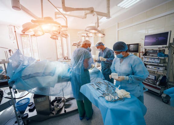 Process of Trauma Surgery Operation. Group of Surgeons in Operating ...