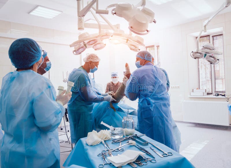 Process of Trauma Surgery Operation. Group of Surgeons in Operating ...