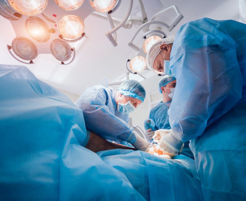 Process of Trauma Surgery Operation. Group of Surgeons in Operating ...