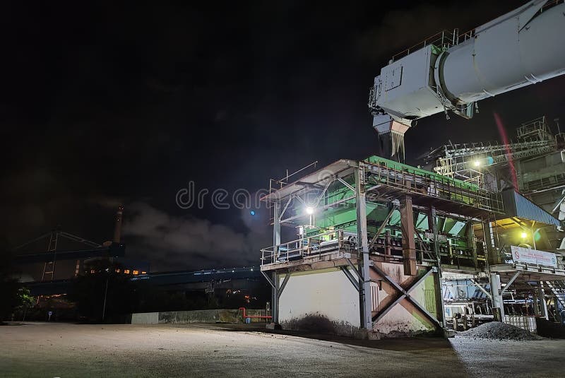 The Process of Unloading Coal from the Ship To the Hopper Stock Photo ...