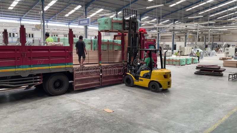 The Process of Unloading Goods from Trucks with Forklifts. Stock ...