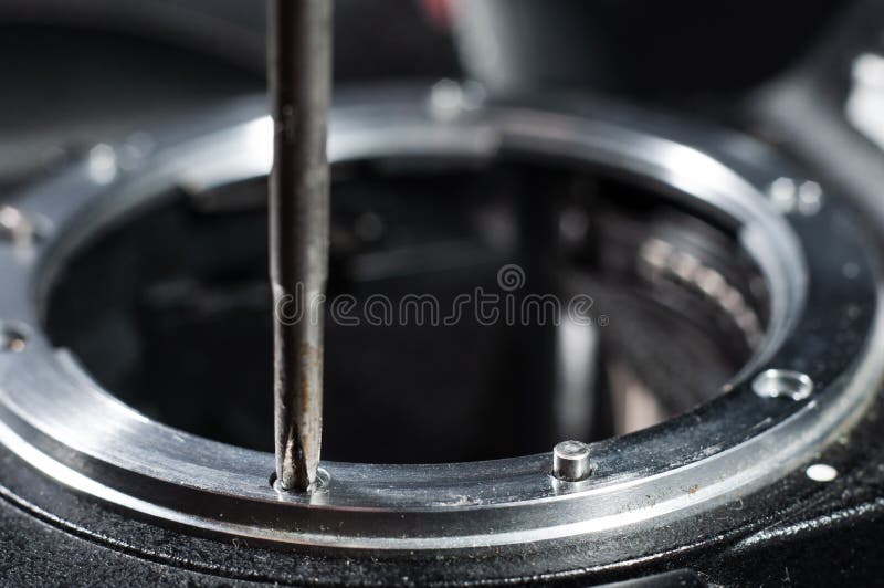 The Process of Unscrewing the Camera Mount To Replace a Worn Part Stock ...