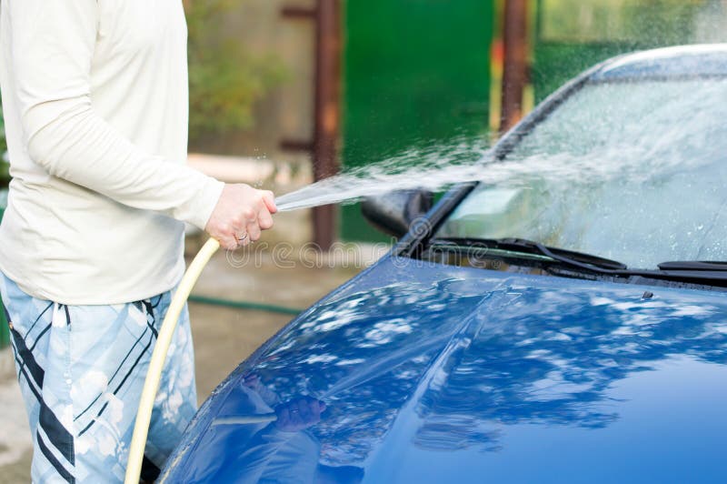 The Process of Washing Cars with a Hose with Water Stock Photo - Image ...