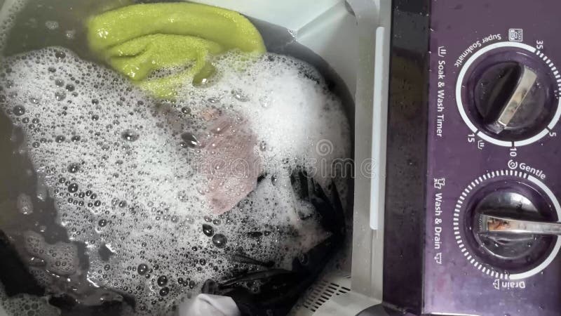 The Process of Washing Clothes in a Washing Machine Stock Footage ...