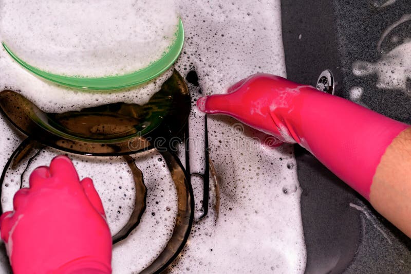 The Process of Washing Plates in the Sink, Hands and Plates Closeup ...