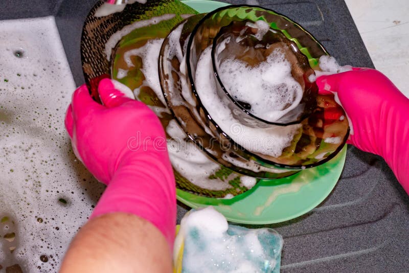 The Process of Washing Plates in the Sink, Hands and Plates Closeup ...