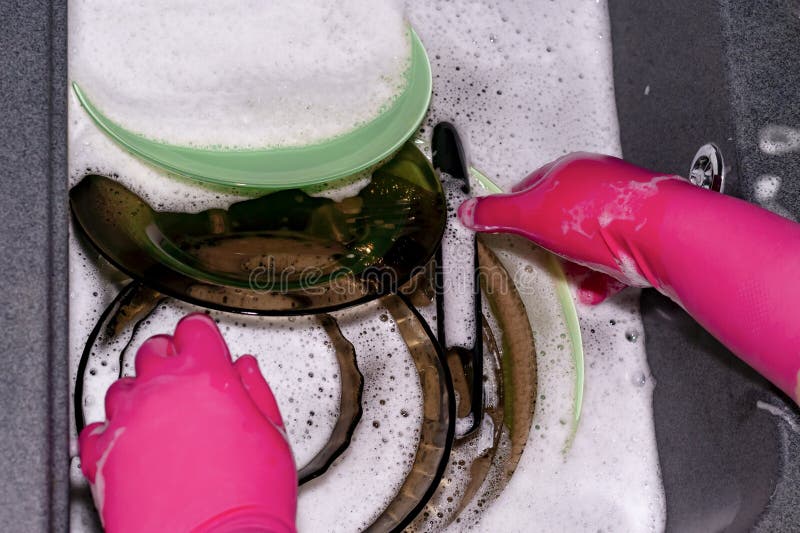 The Process of Washing Plates in the Sink, Hands and Plates Closeup ...
