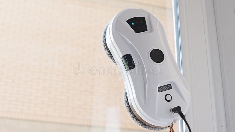 The Process of Washing Windows with a Robot Cleaner. Stock Footage ...