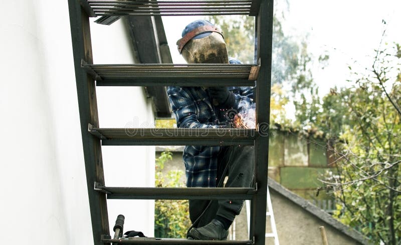 The Process of Welding Metal Ladder Stock Photo - Image of gloves ...