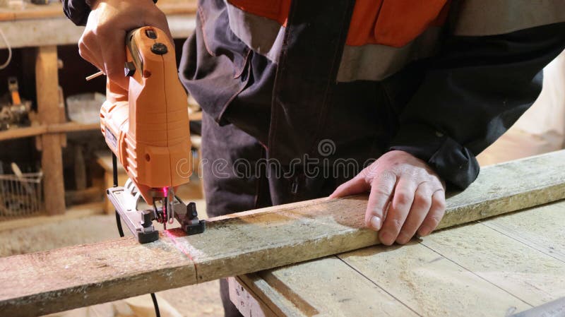 The Process of Working with an Electric Jigsaw Stock Image - Image of ...