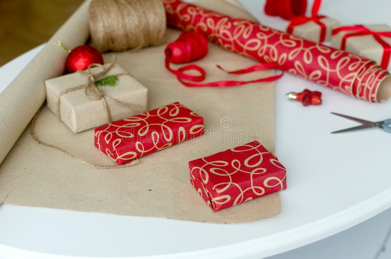 Process of Wrapping Christmas Gift Boxes in Craft Paper. Preparation ...