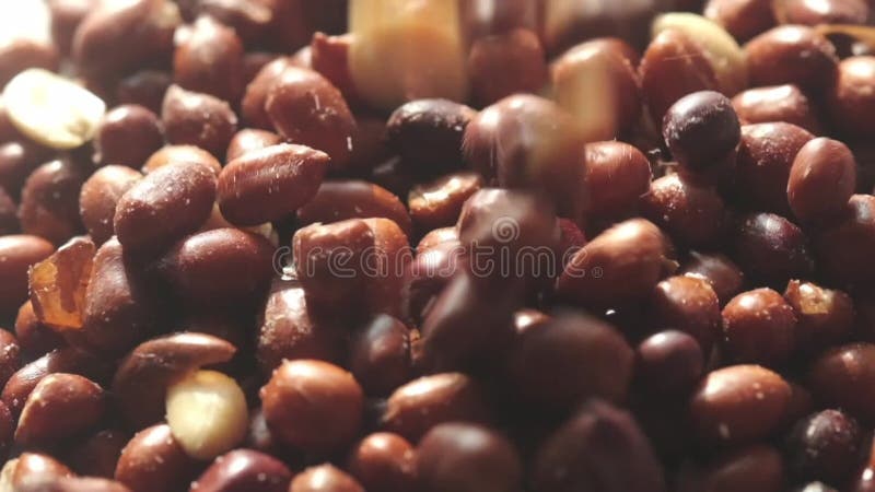 Slow Motion of Dropping Processed Pea Nuts on Table Stock Footage ...