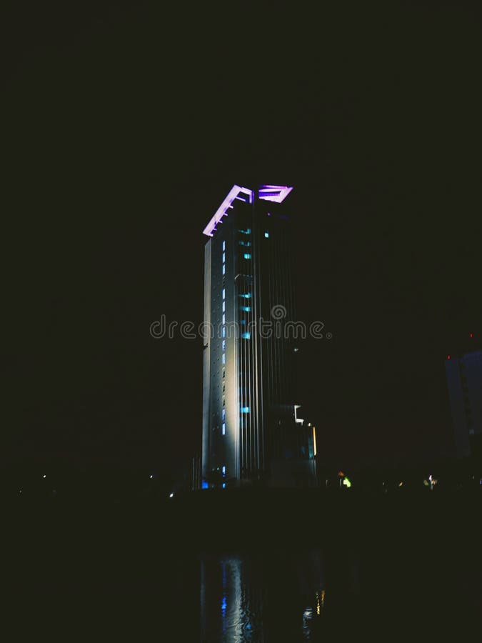 Skyscraper Building with Lake View Shining at Night Time Stock Image ...